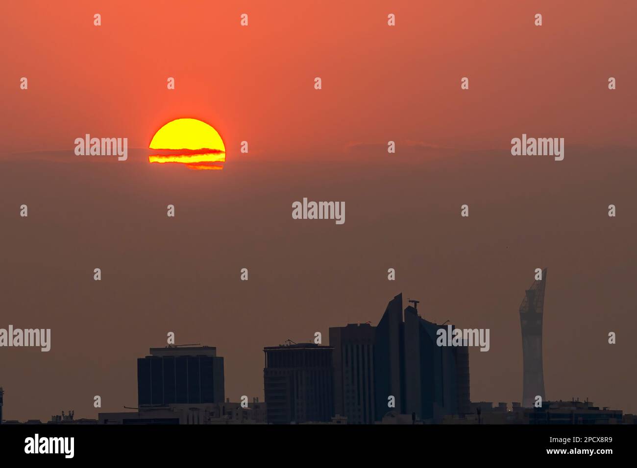The Torch Tower in Doha Sport City Complex at sunset next to Aspire ...