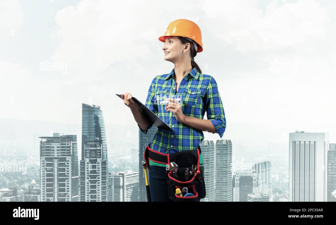 Young building inspector checking outdoor Stock Photo - Alamy