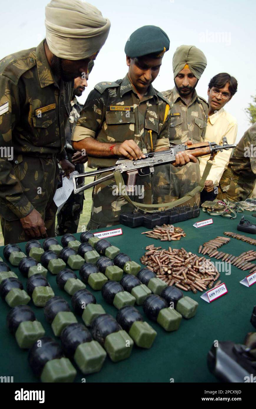 Indian Army official display arms and ammunition at an army camp in ...