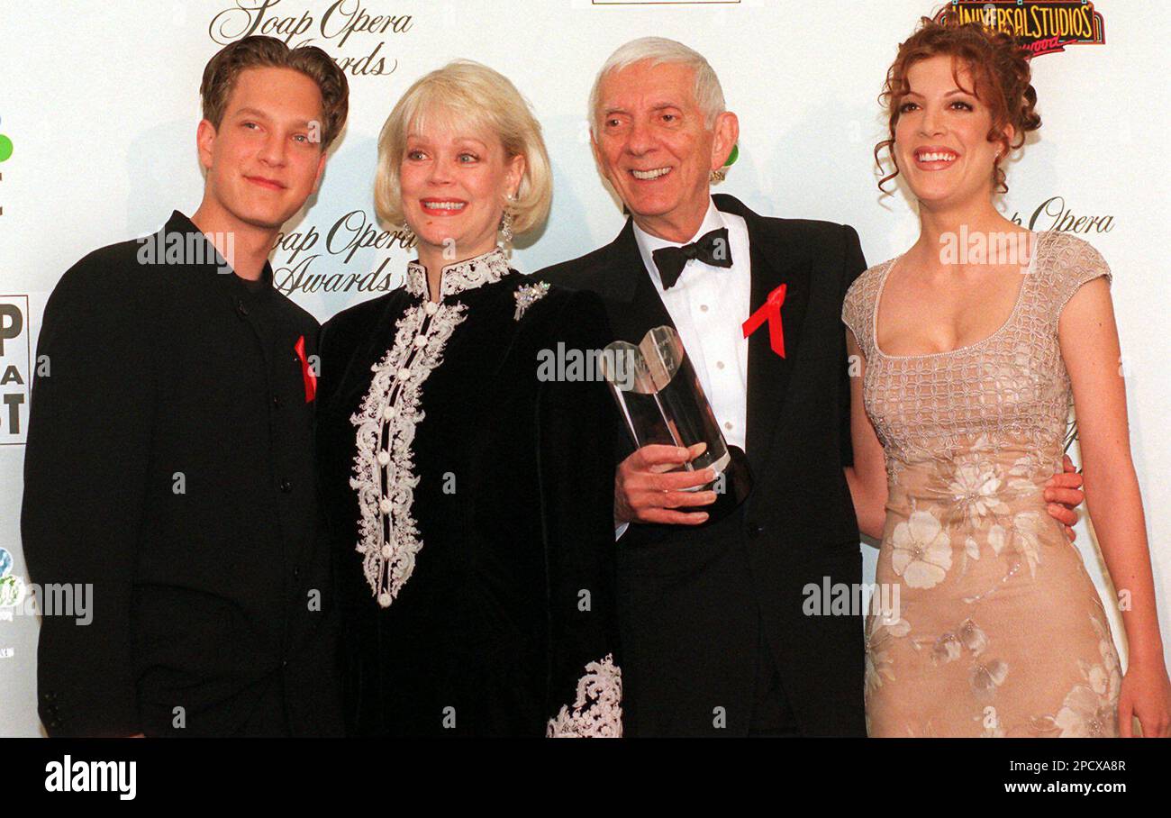 **FILE** Aaron Spelling holds his Soap Opera Digest Award as his family ...