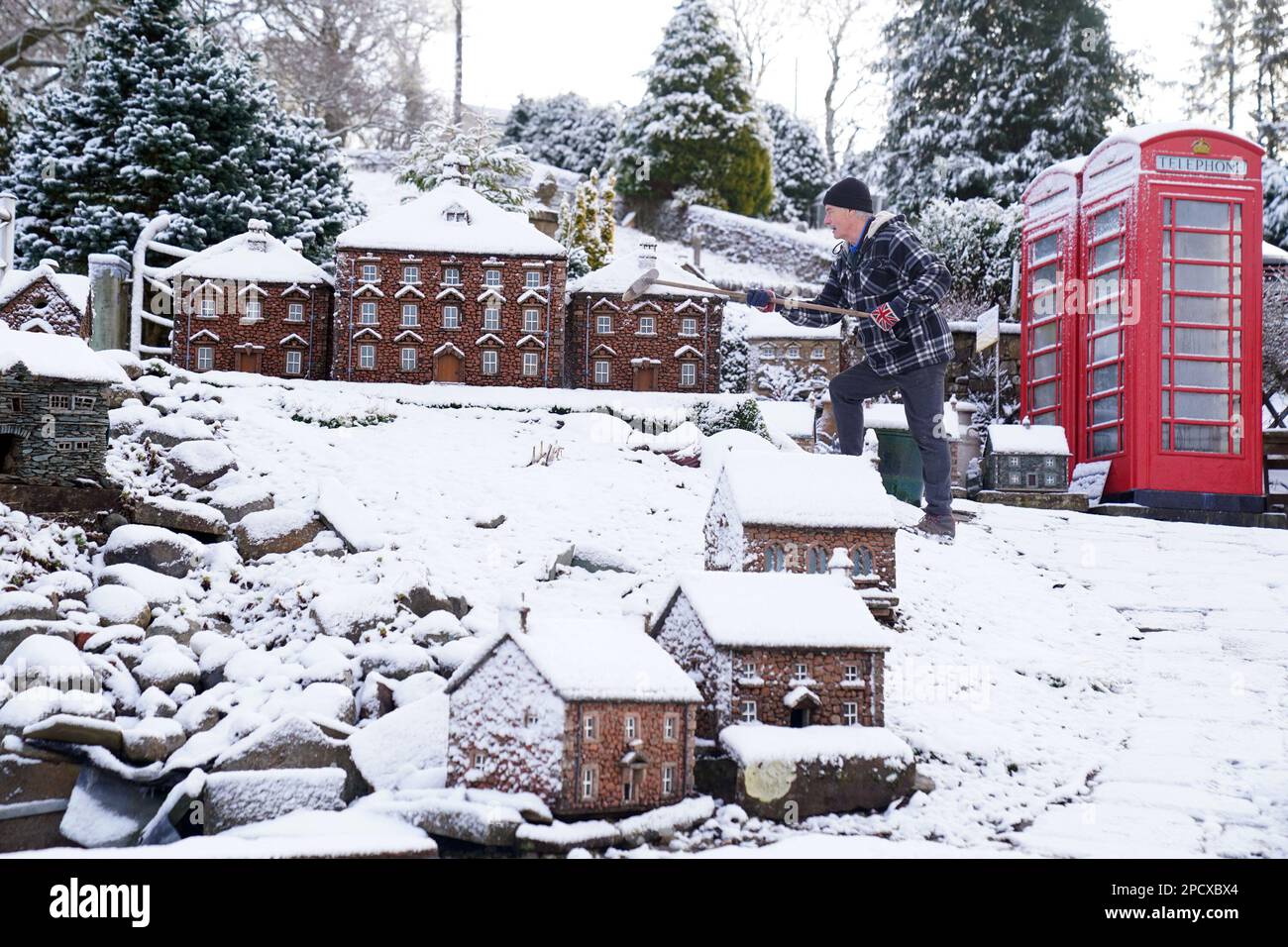 Lawson Robinson, 77, clears snow from his model village he built in his ...