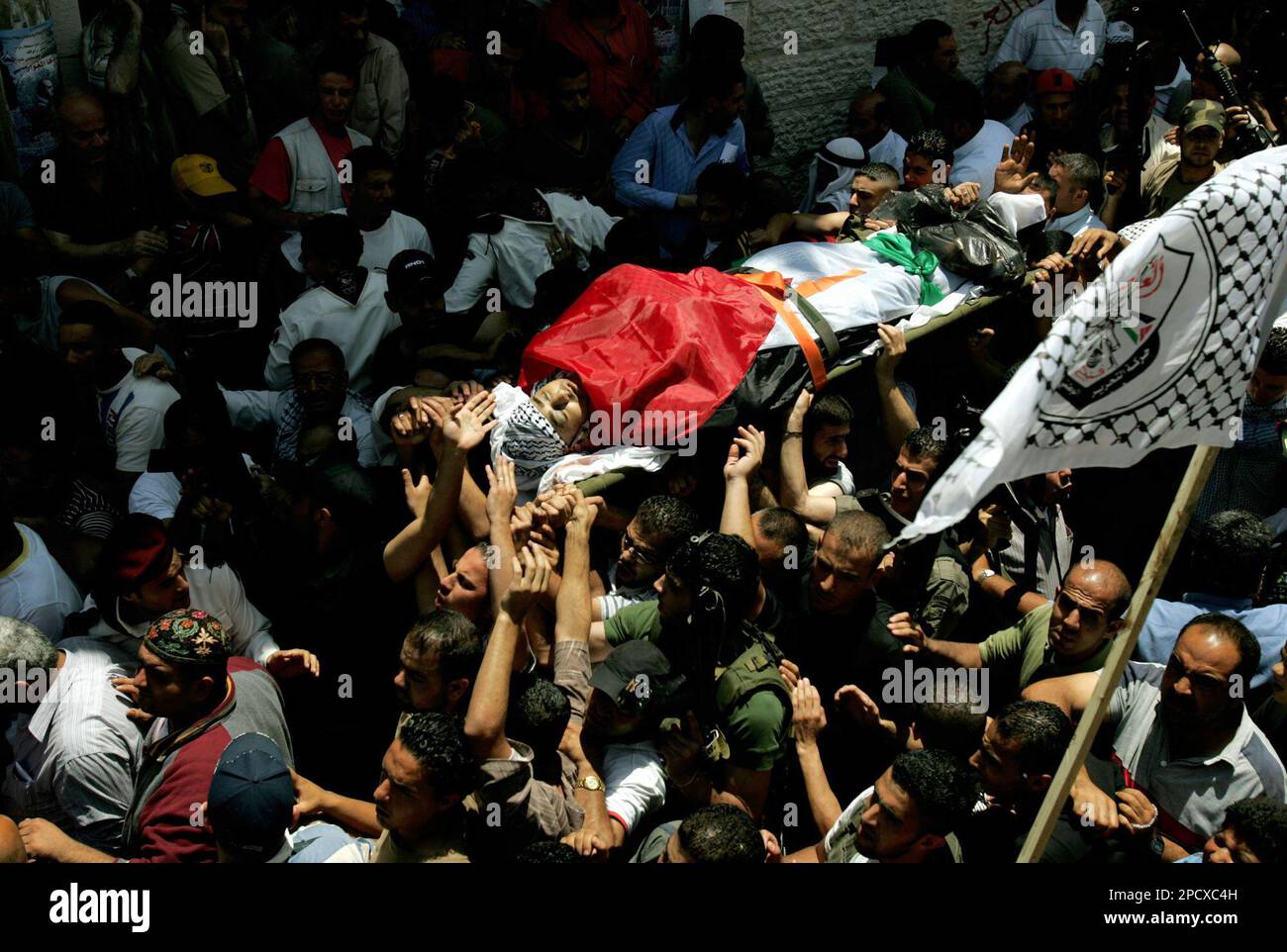 Palestinians carry for burial the body of Ayman Rateb Gabareen, a ...