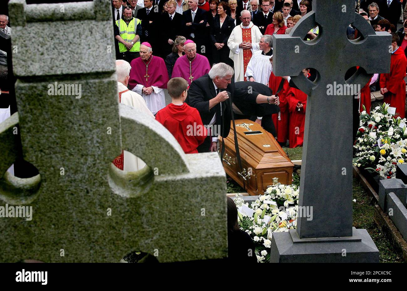 The coffin of Monsignor Denis Faul is buried at St Colmcille's Catholic ...
