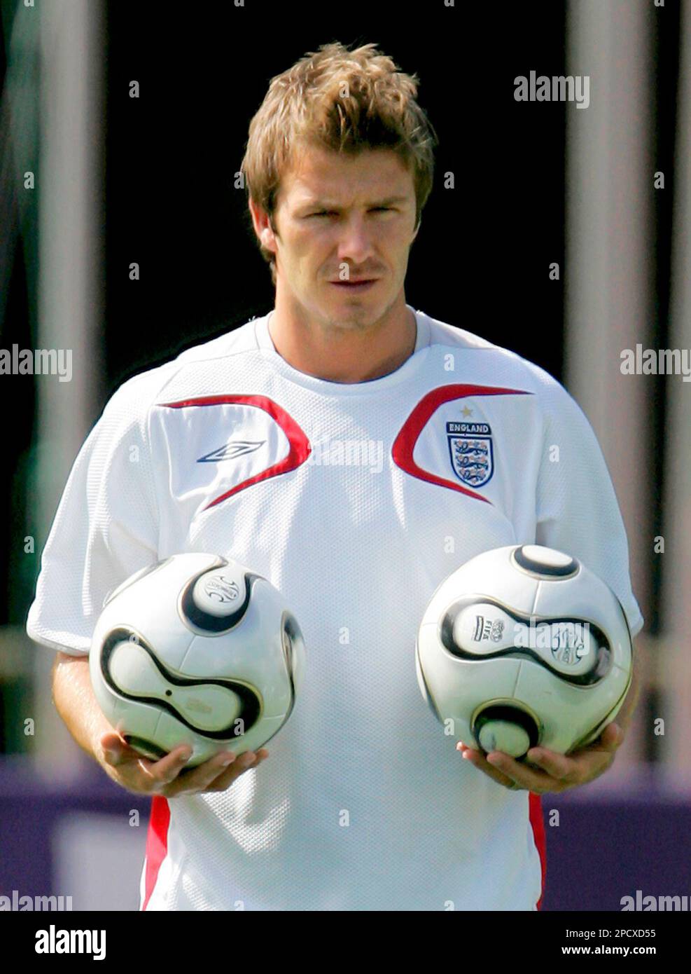 England national soccer team captain David Beckham holds two soccer ...