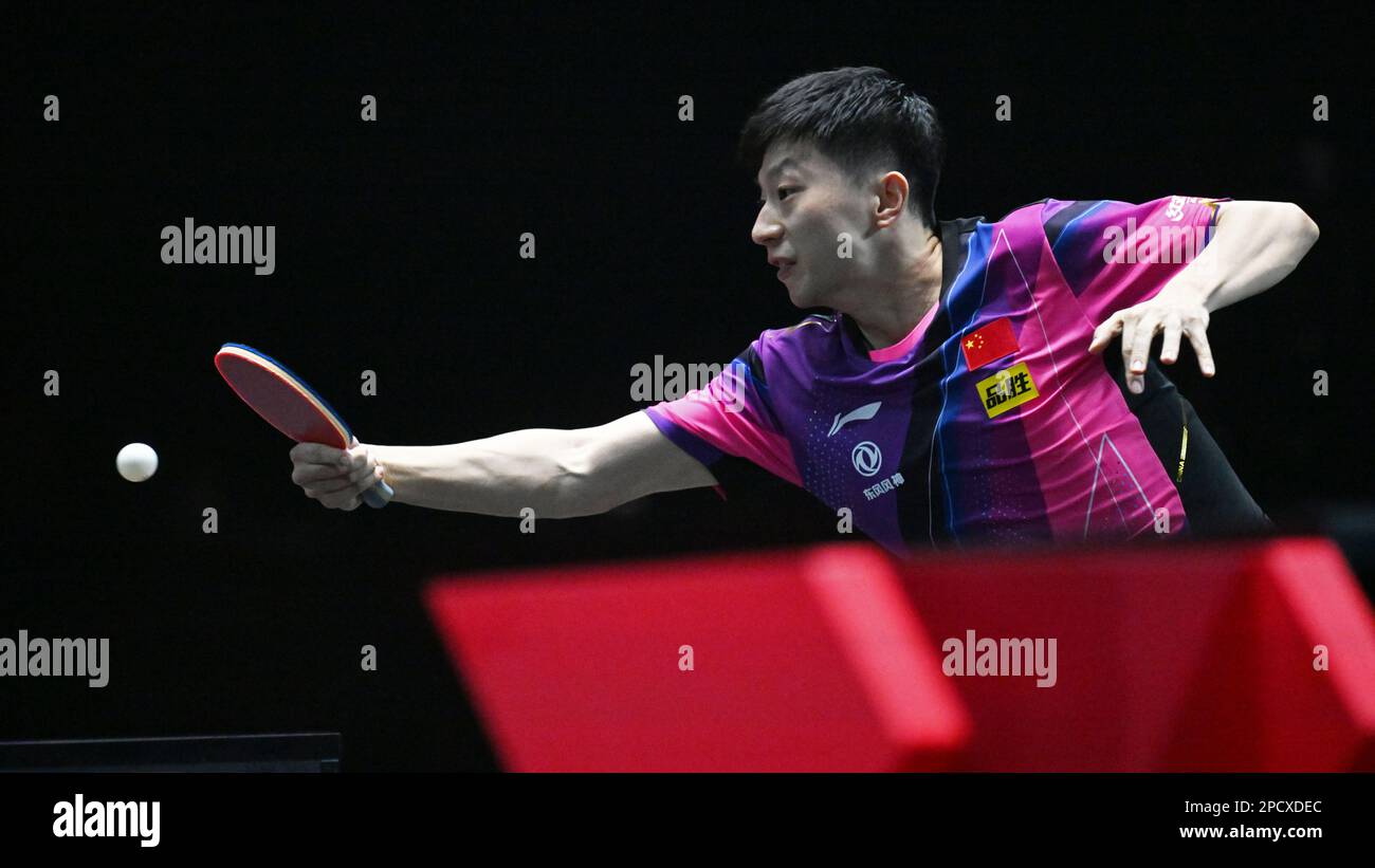 Singapore. 14th Mar, 2023. Ma Long of China hits a return during the ...