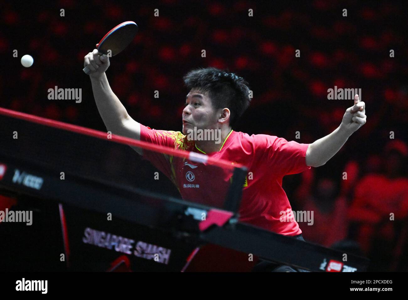 Singapore. 14th Mar, 2023. Lin Shidong of China hits a return during ...