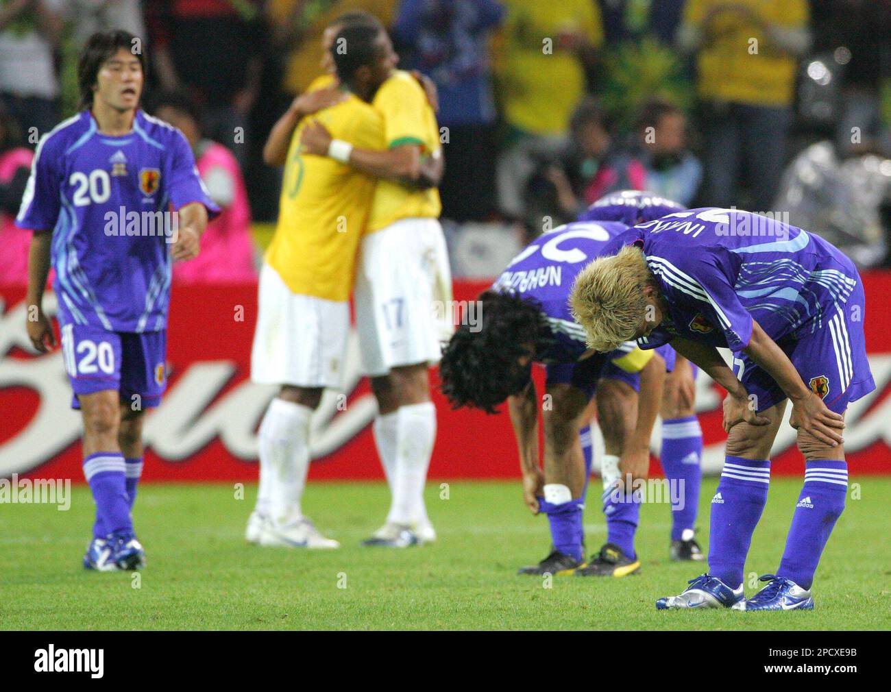 Japan's Junichi Inamoto, right, and Yuji Nakazawa react at the end of ...