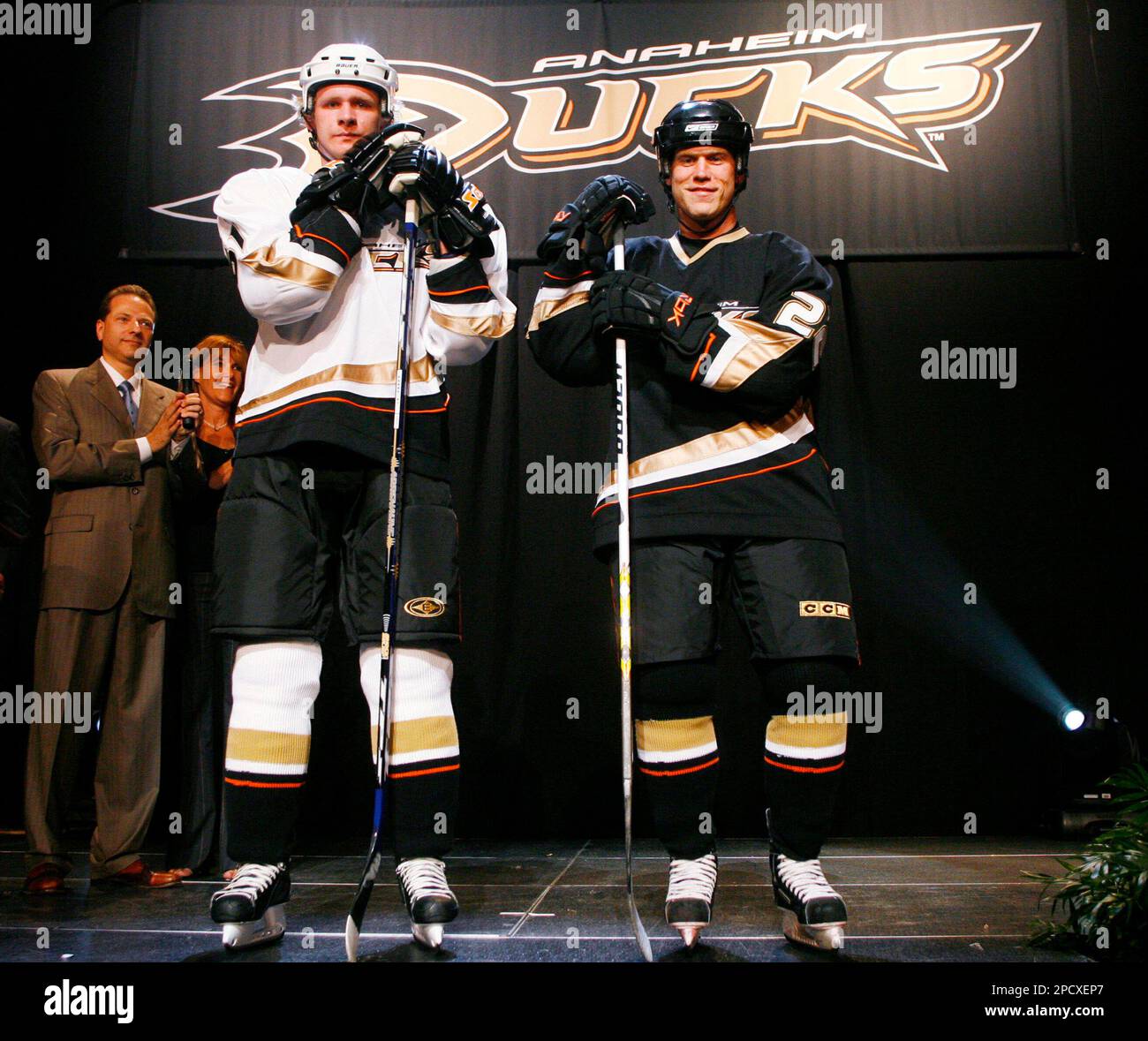 Anaheim Ducks players Corey Perry, left, and Todd Marchant display the ...
