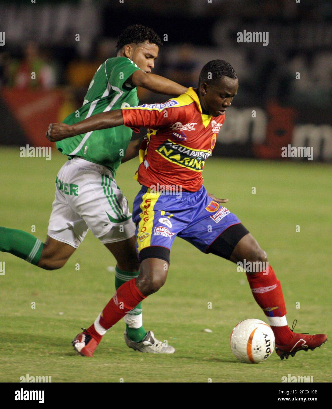 Nelson Rivas, left, of Deportivo Cali, battles for the ball with Deyler ...