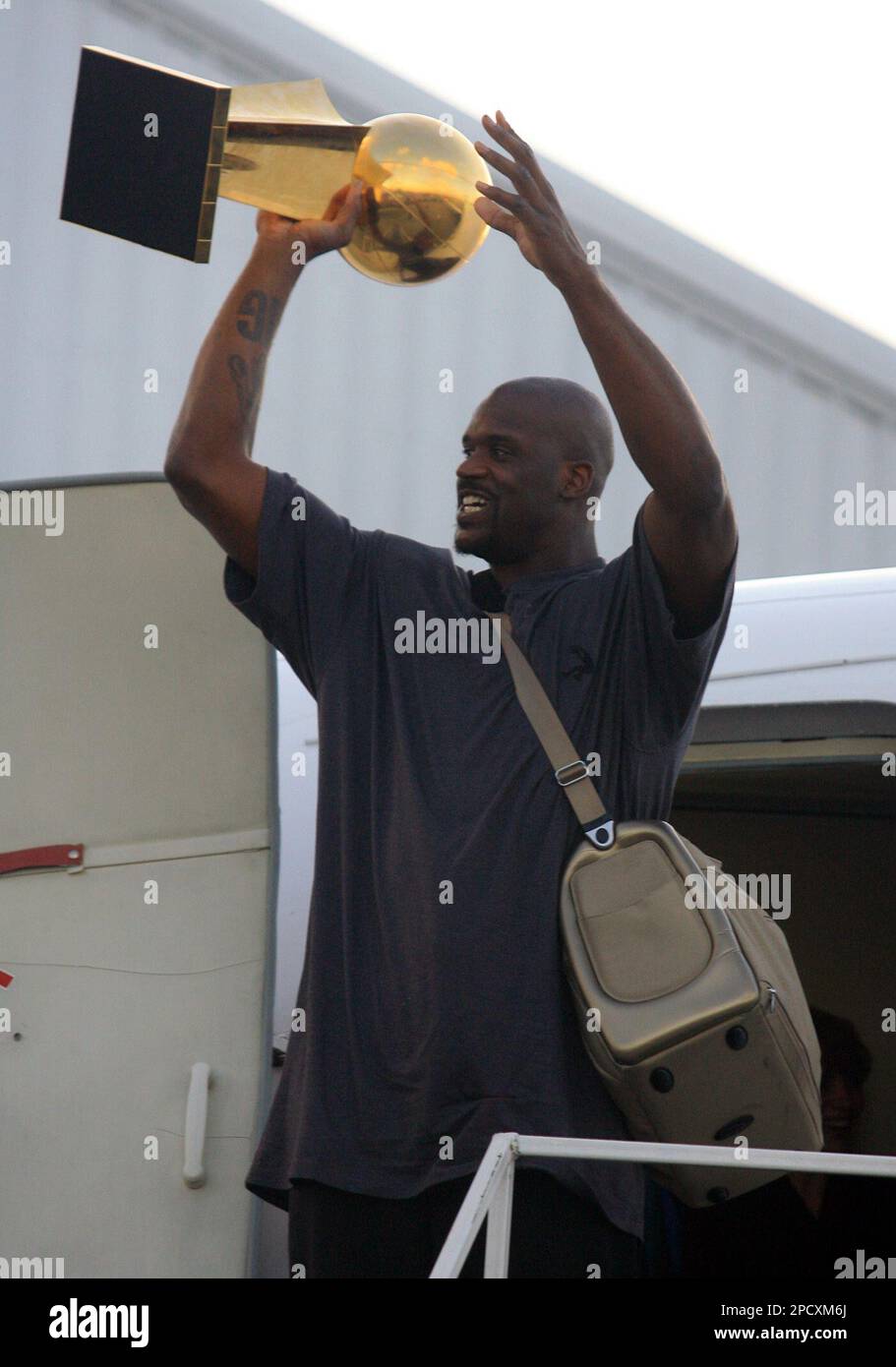 Miami Heat 's Shaquille O'Neal looks at fans as he holds the NBA ...