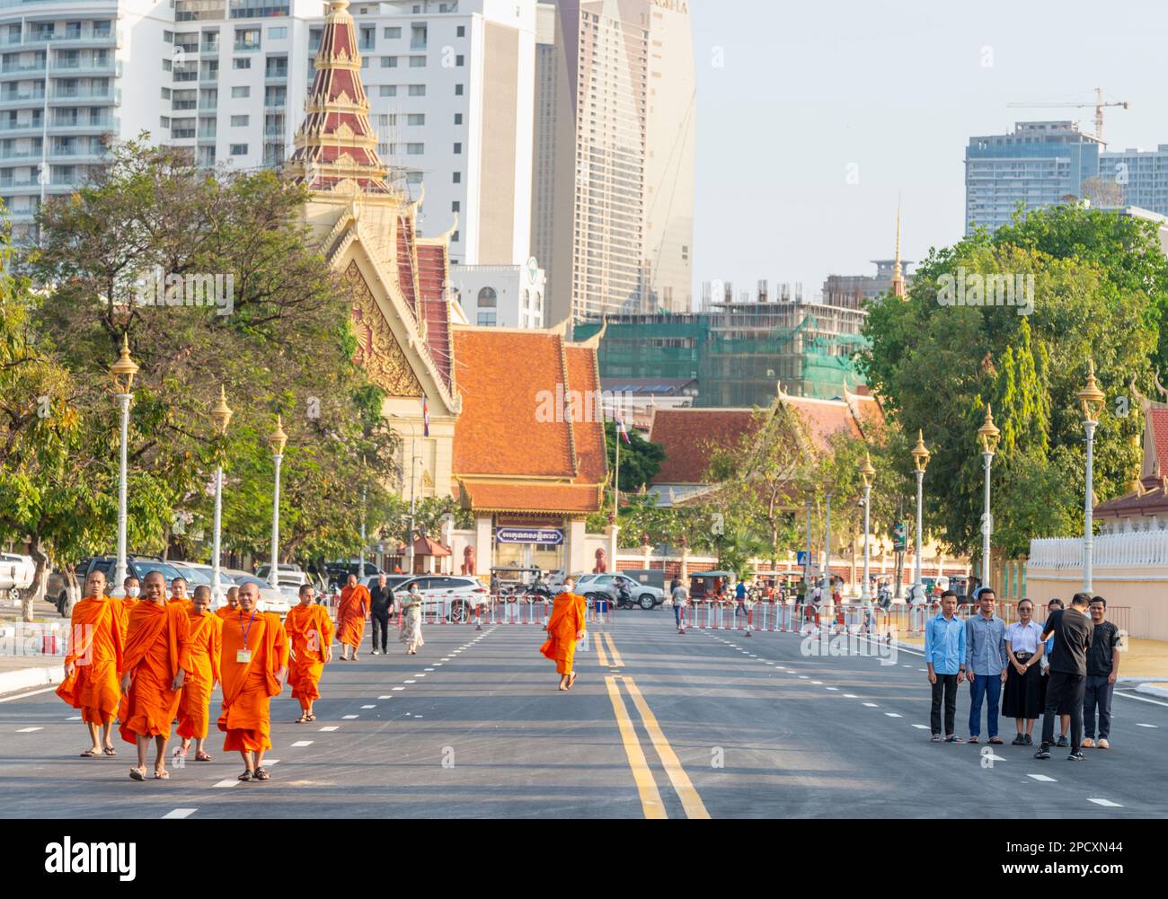 Phnom Penh,Cambodia-December 23 2023: Dressed in traditional orange ...