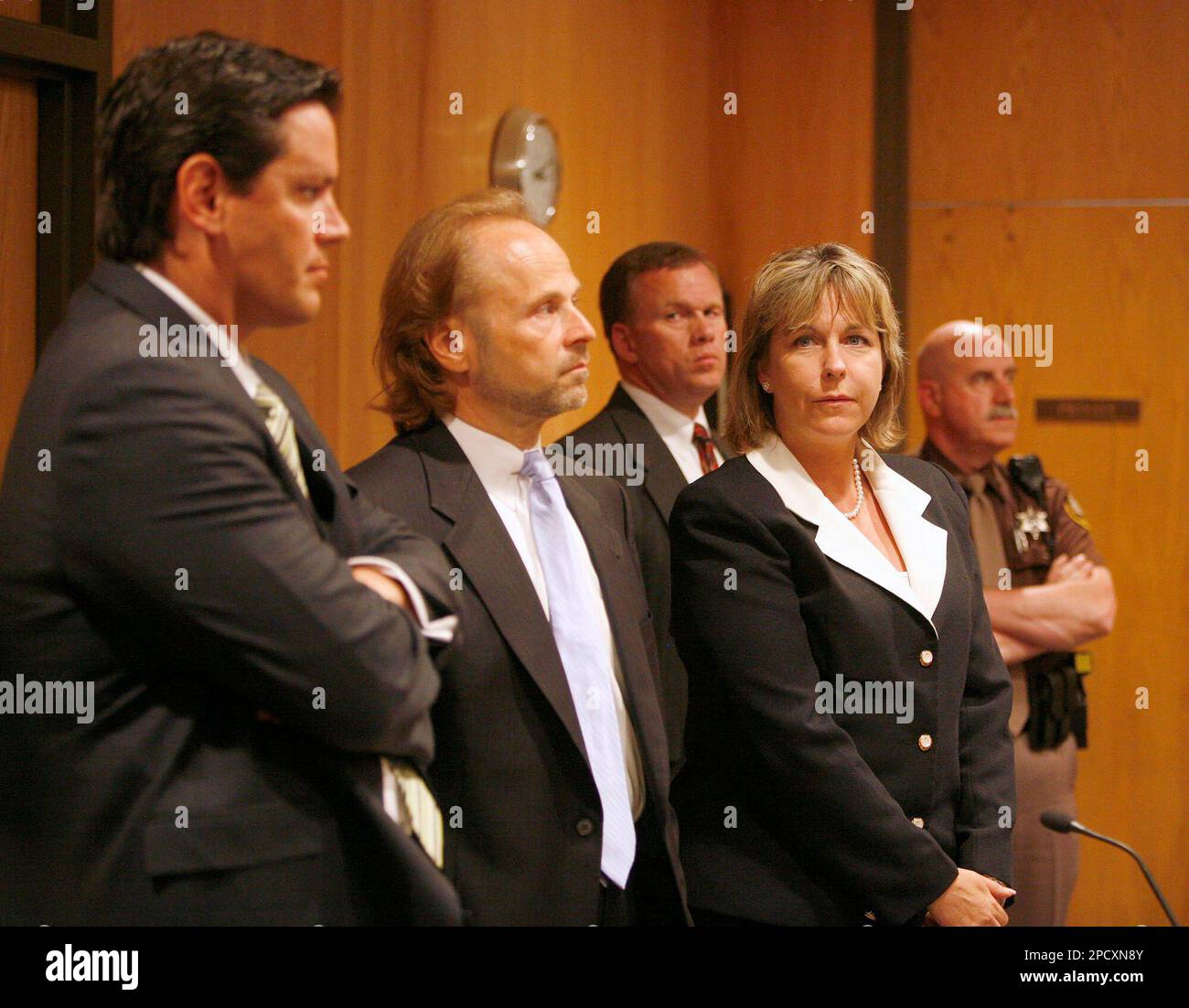 Members of the prosecution team in the murder trial of Mark Unger await ...