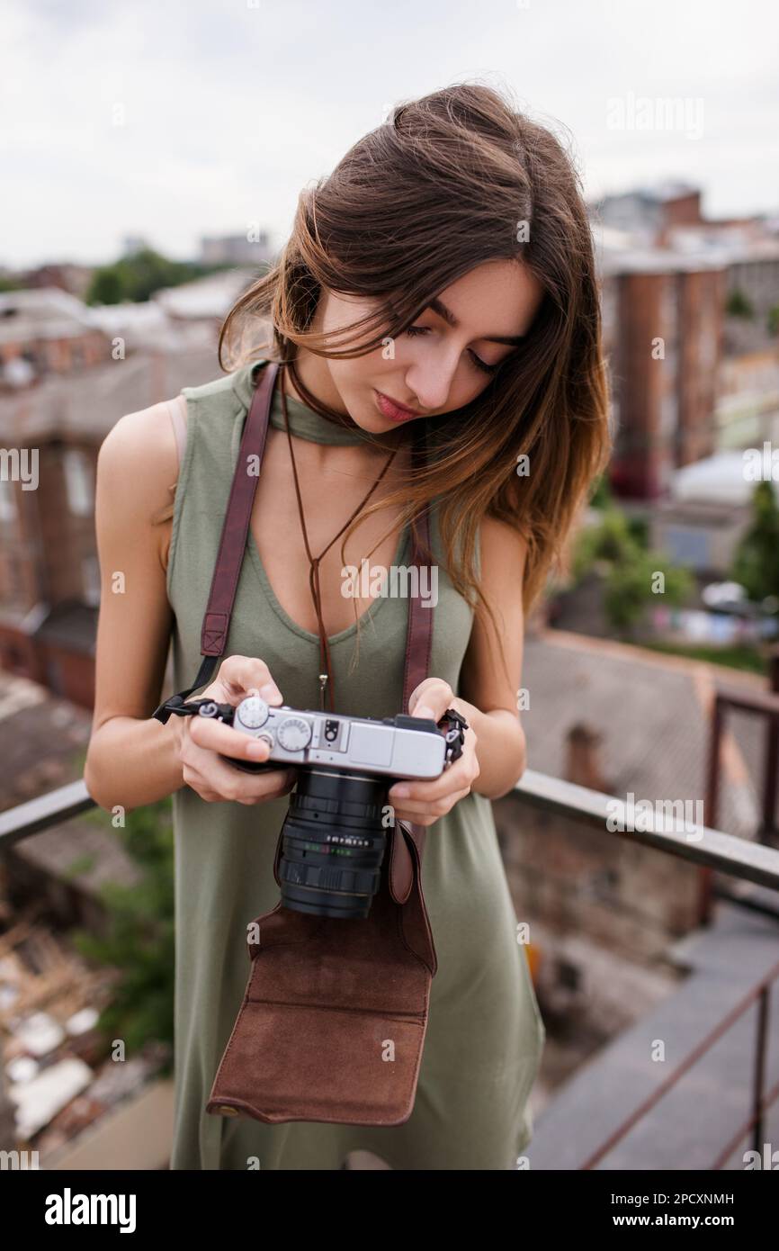 Urban photoshoot woman walk roof concept Stock Photo - Alamy