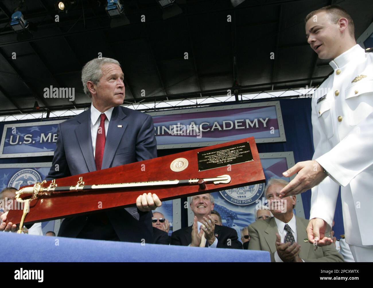 President Bush, left, receives the Regimental Commander's Sword from ...