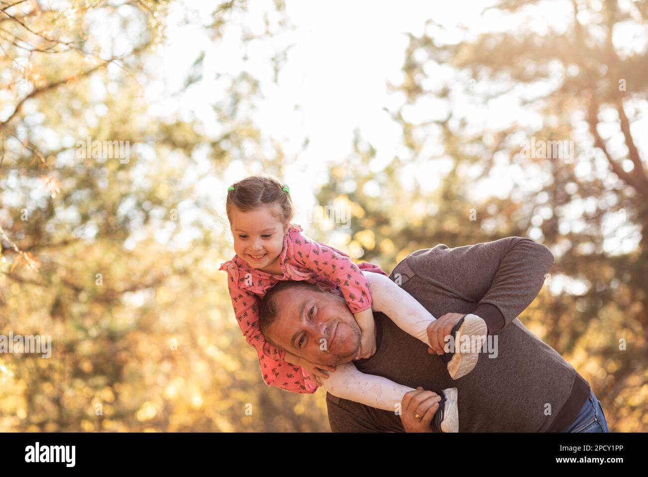 Happy Father And Child Having Fun Playing Outdoors. Smiling Young Dad ...