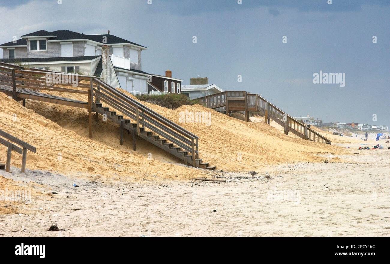 The dune along the beach in Surf City, N.J., shows signs of erosion and is in need of repair ...