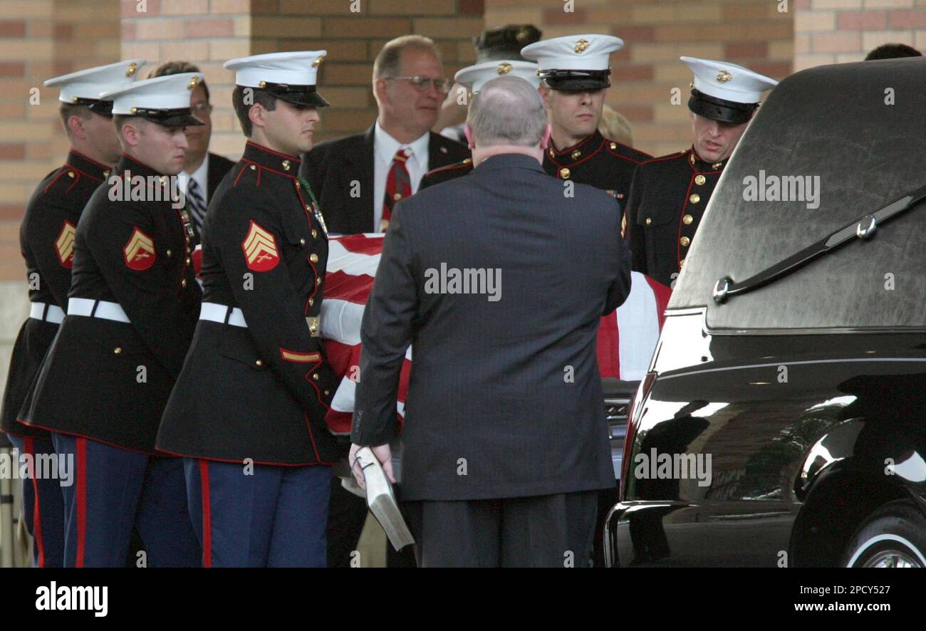 A U.S. Marine color guard places the casket of Marine Sgt. Mark ...