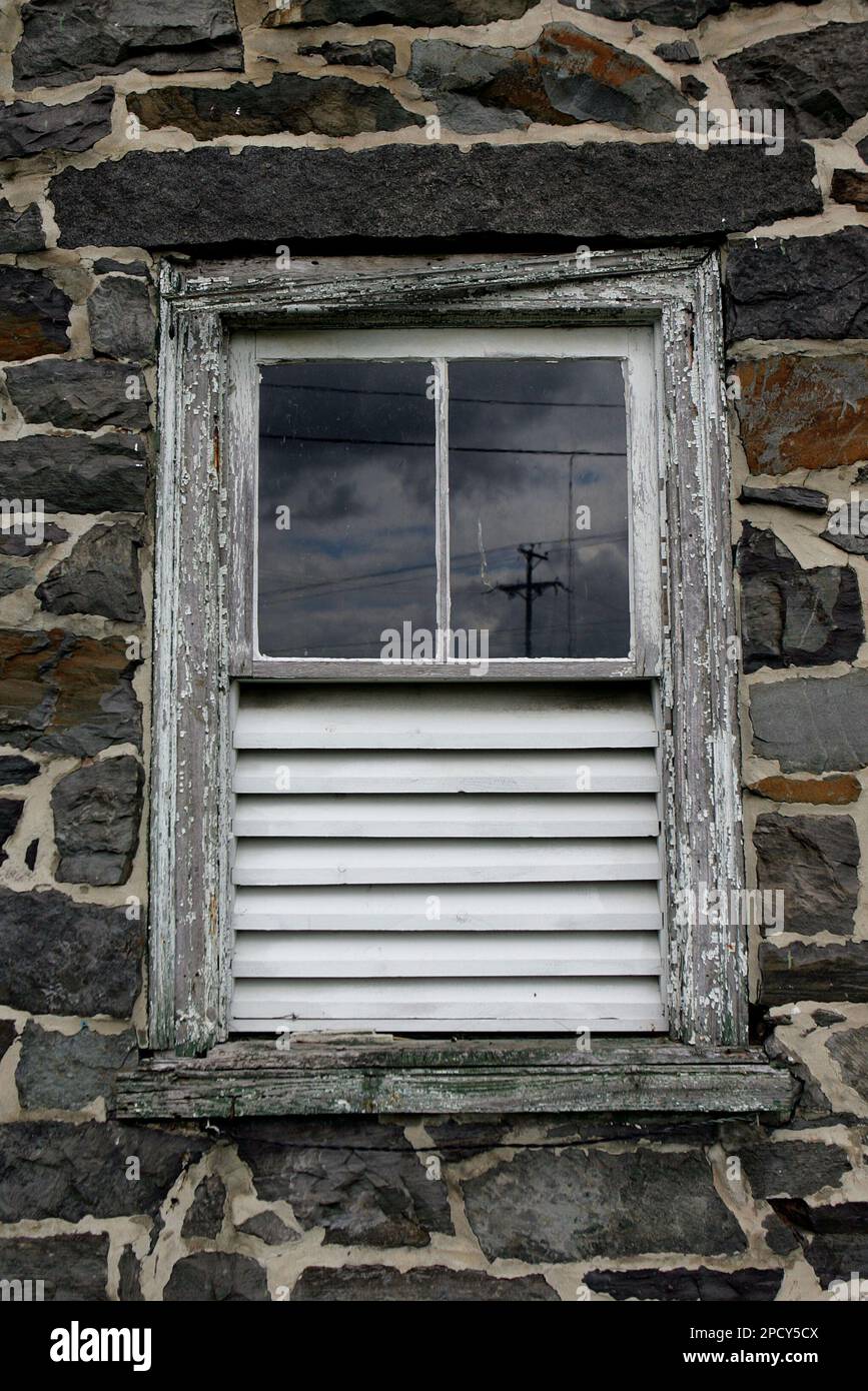 This window frame on the Blocher House shows rotting wood and peeling ...