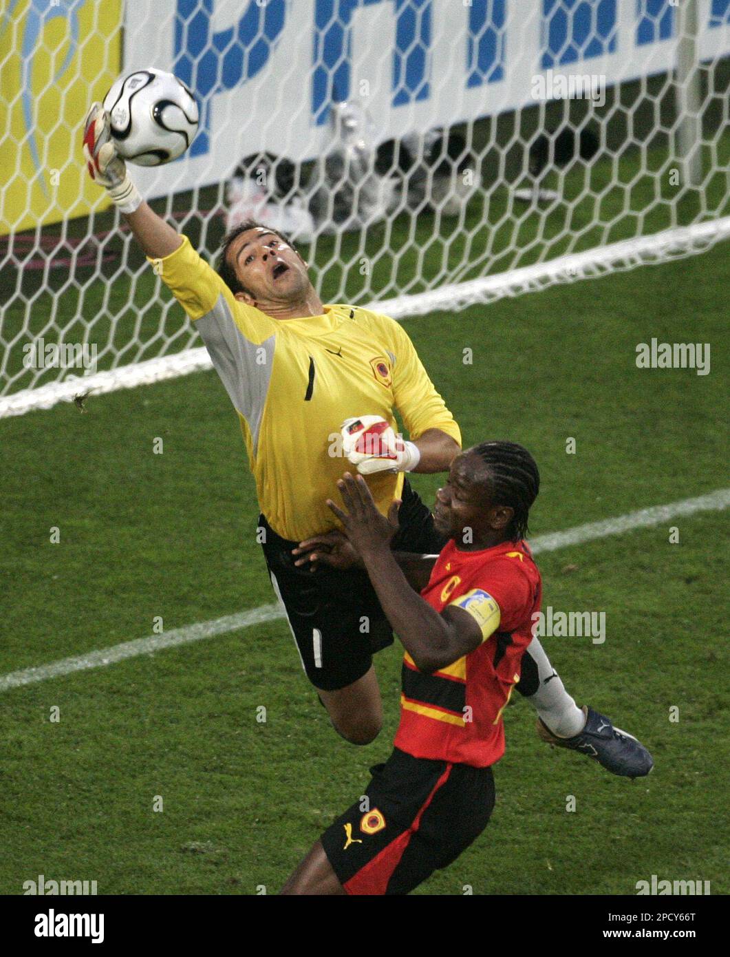 Angola goalie Joao Ricardo (1) makes a save in front of teammate Akwa ...