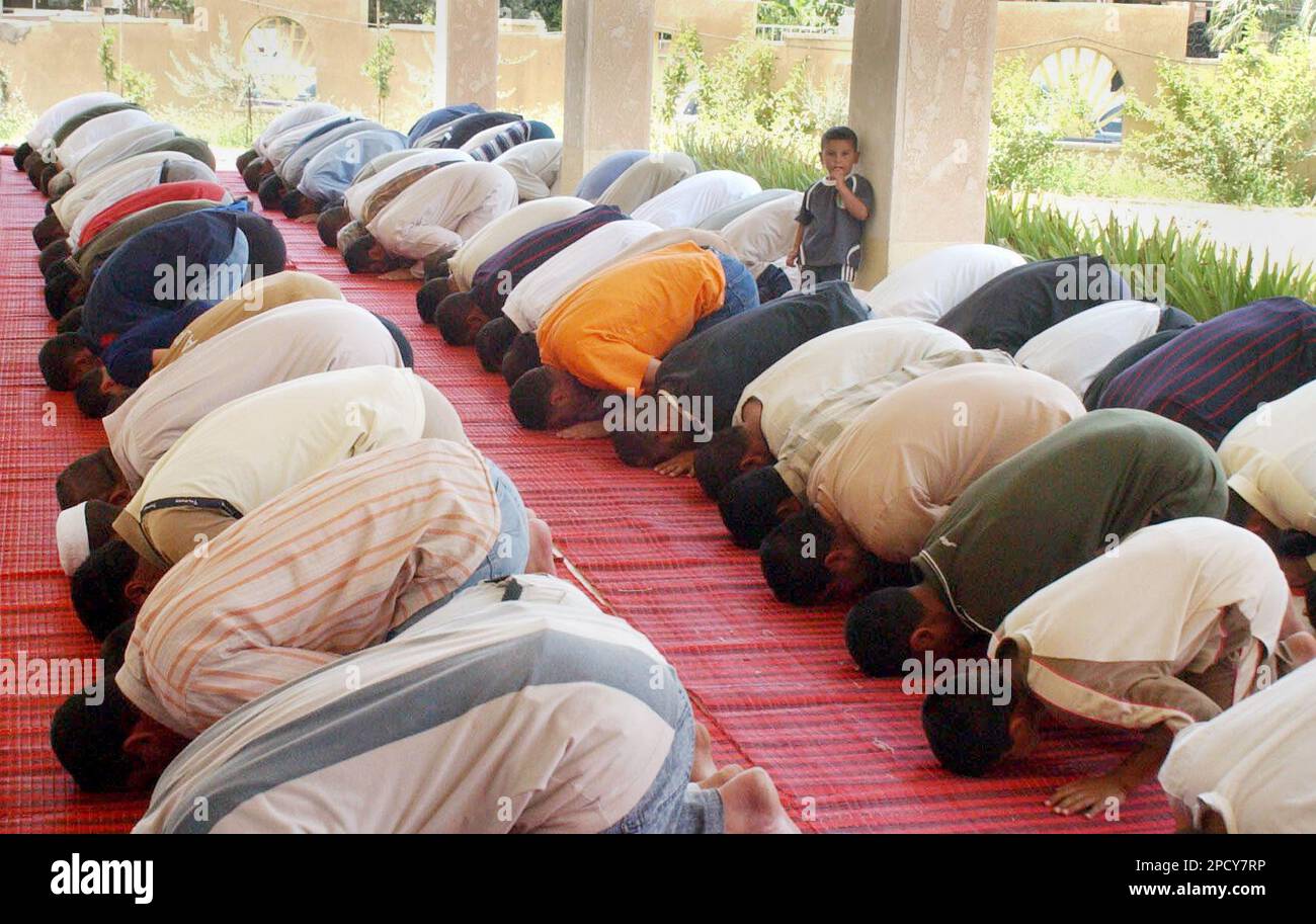 Sunni Muslims give traditional Friday prayers at the Sultan mosque in ...