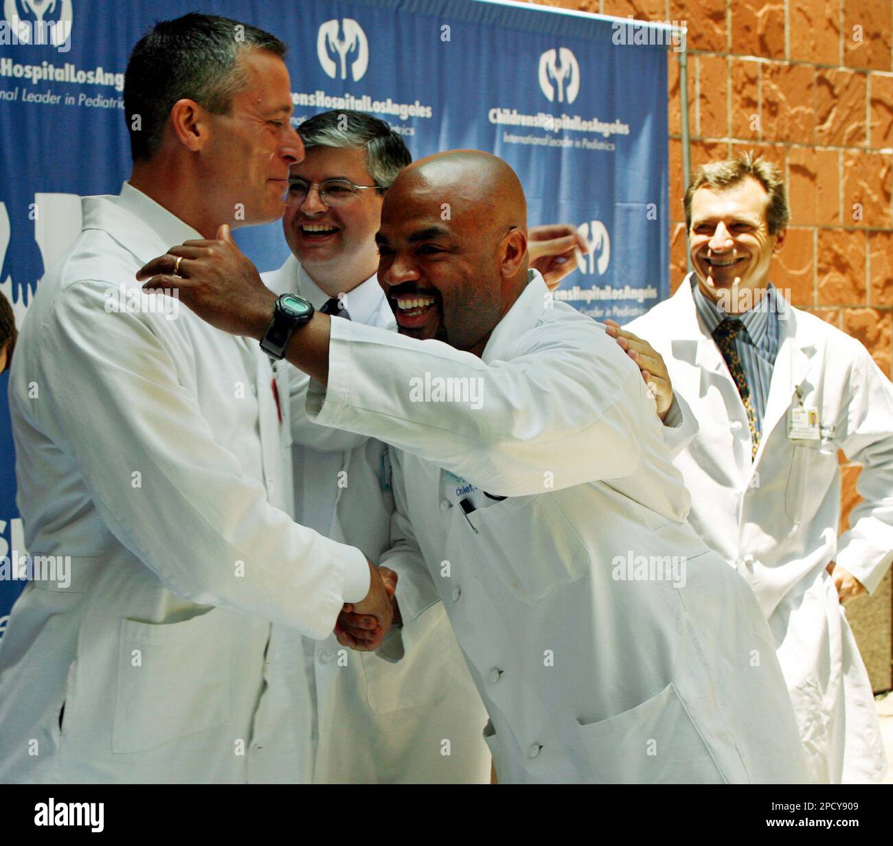 Pediatric reconstructive and plastic surgeon Dr. John Gross, left, is ...