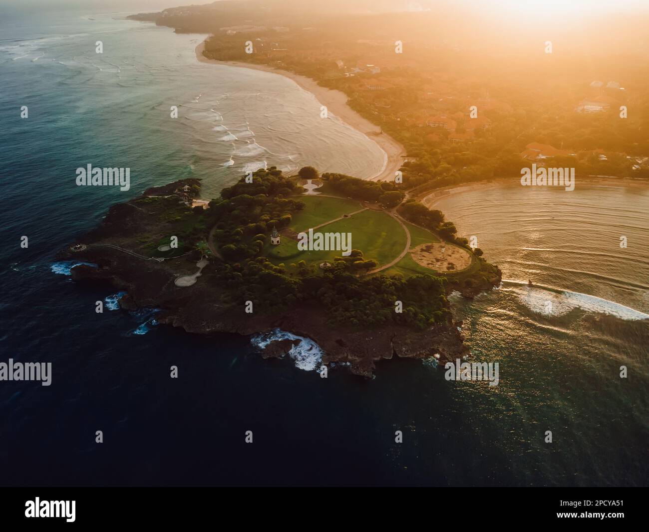 Aerial view of scenic coastline with, warm sunset sunshine, ocean in ...