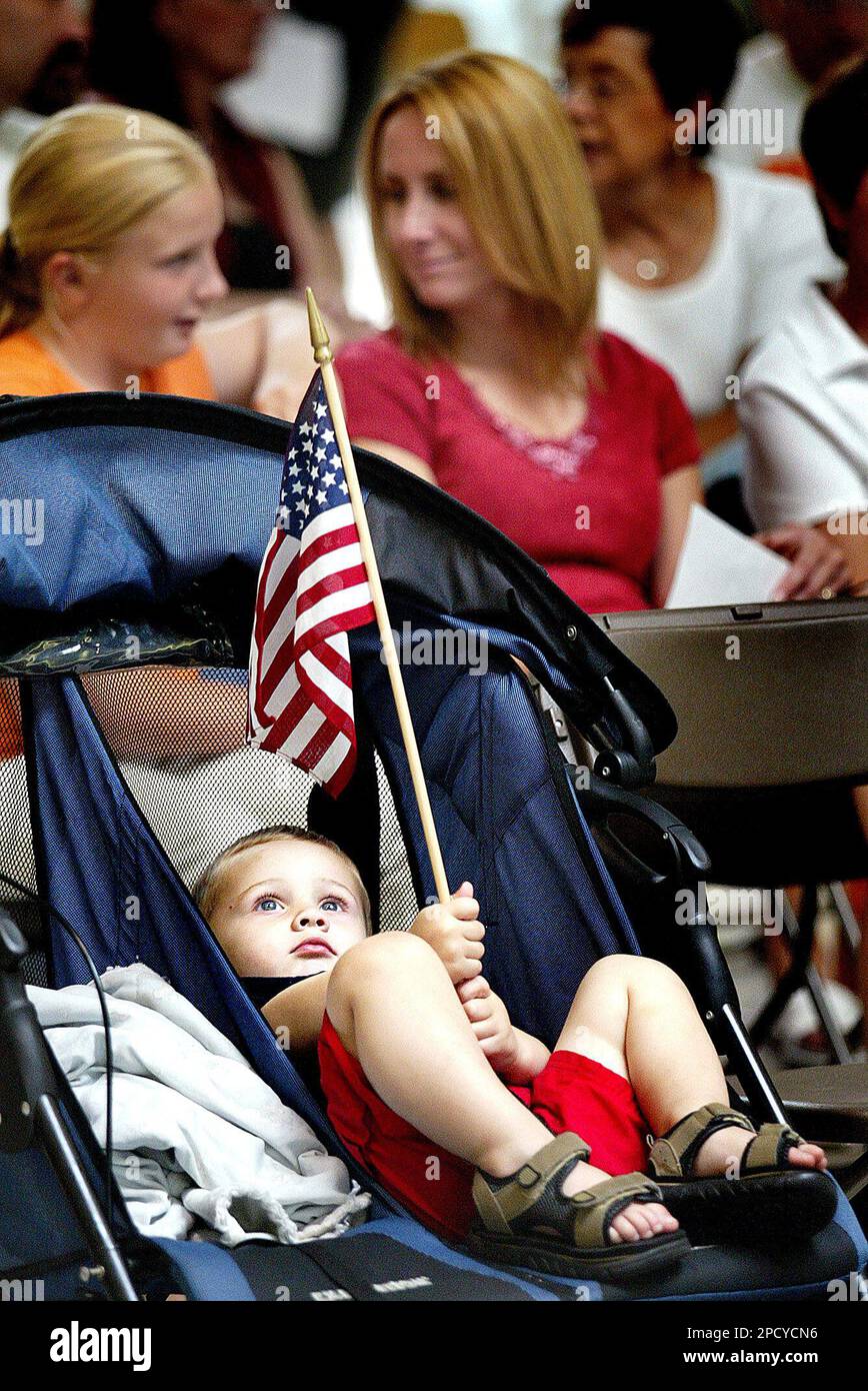 Griffin Brooks, 2, of Onalaska, Wis., flies an American flag Wednesday ...