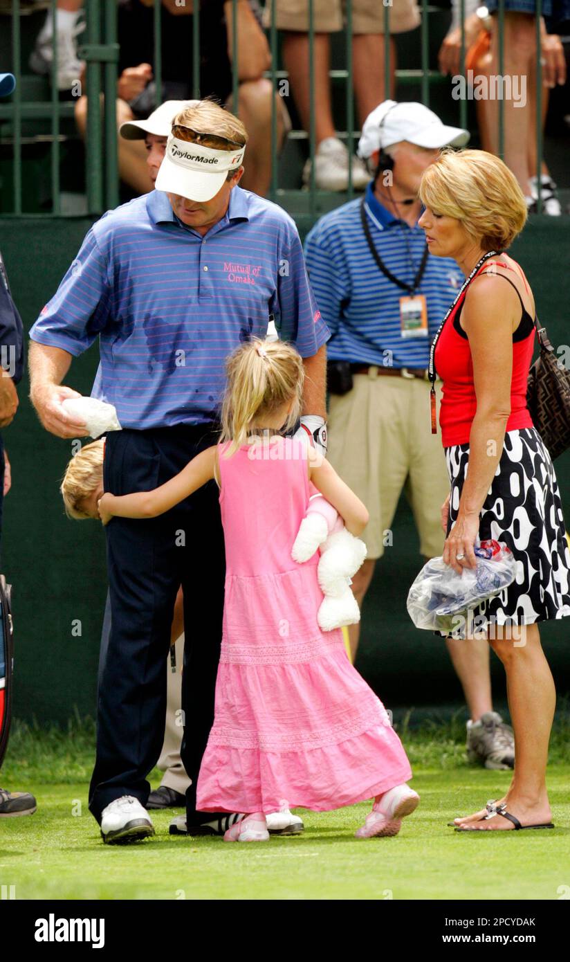 Perry Leigh, 6, hugs her father, Fred Funk, as she wishes him a happy ...