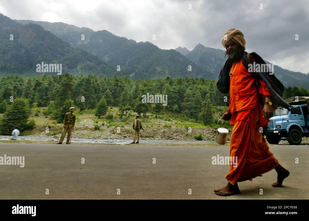 A Hindu hermit walks towards the Holy Amarnath shrine as Indian ...