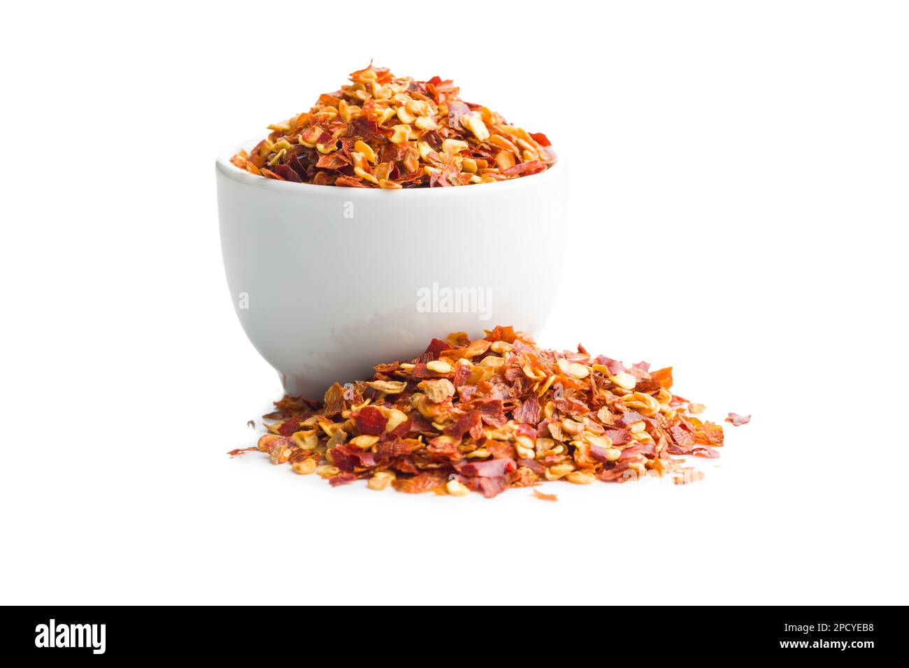 Dry chili pepper flakes in bowl. Crushed red peppers isolated on the ...