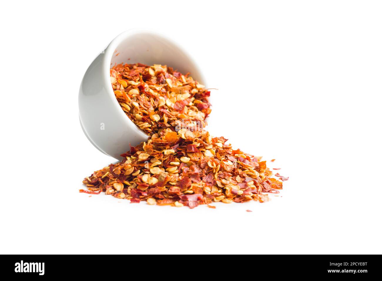Dry chili pepper flakes in bowl. Crushed red peppers isolated on the ...