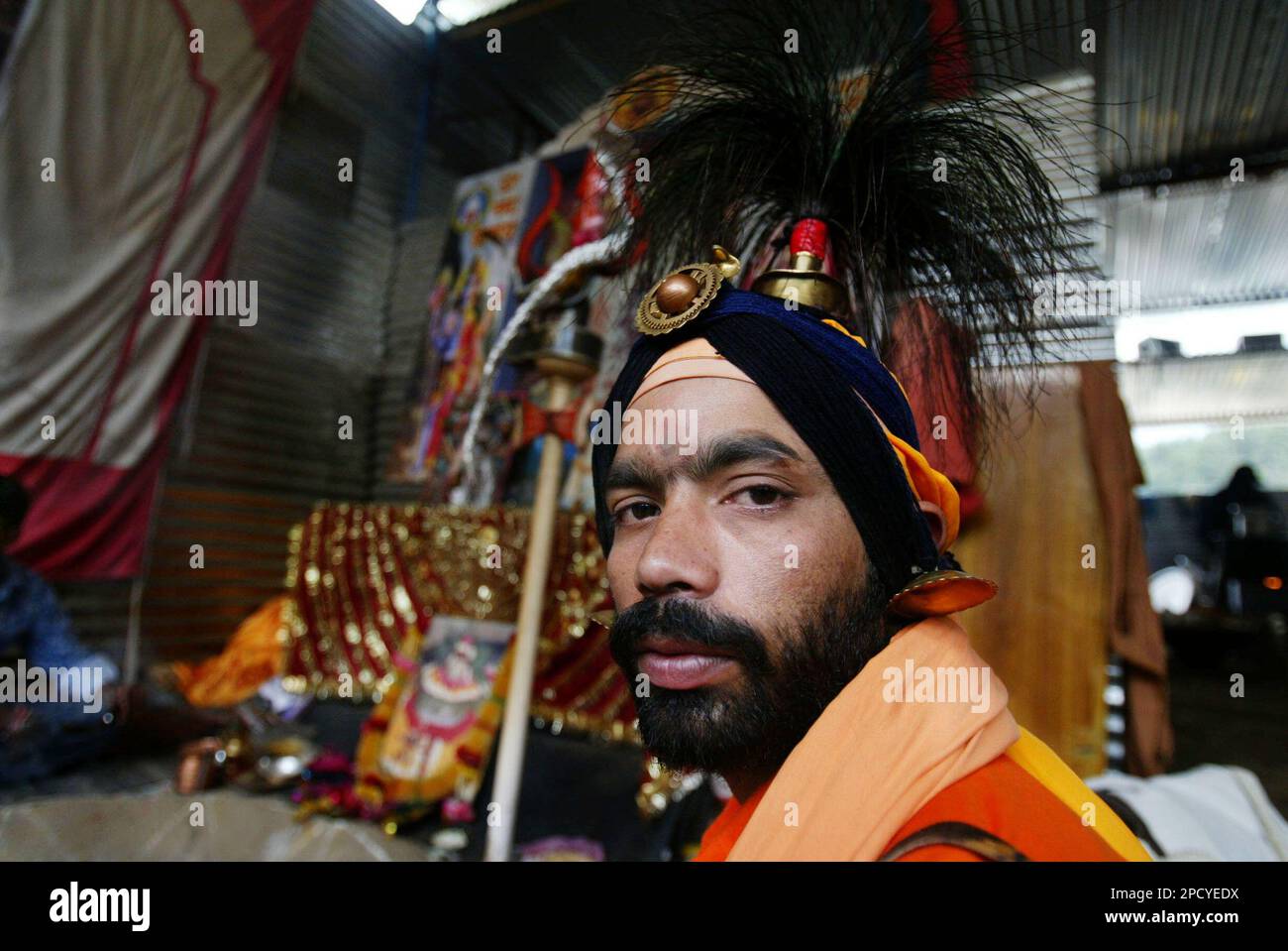 A Hindu hermit sits inside a makeshift temple at Pahalgam, 95 ...