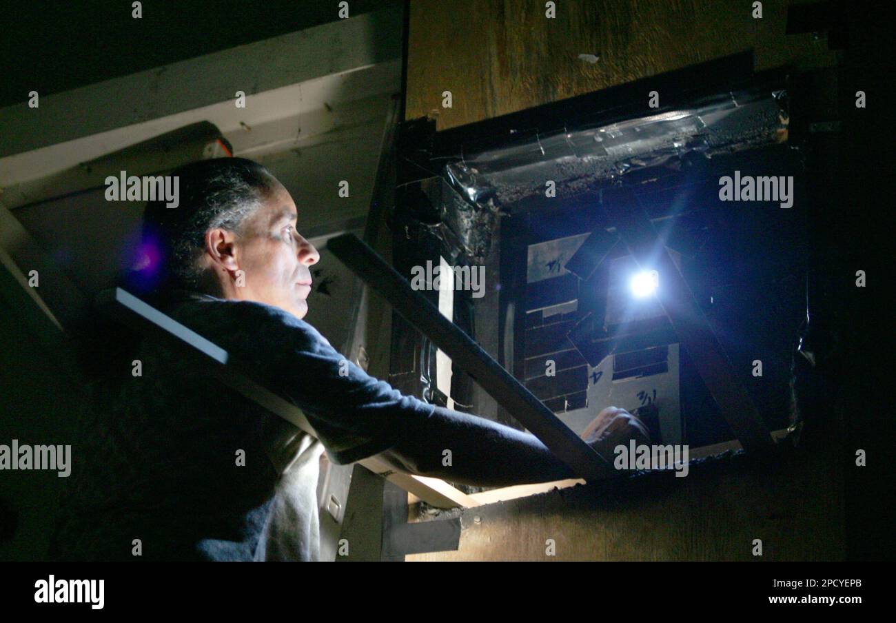 Photographer Clayton Spada looks at the pinhole camera Tuesday, June 13 ...