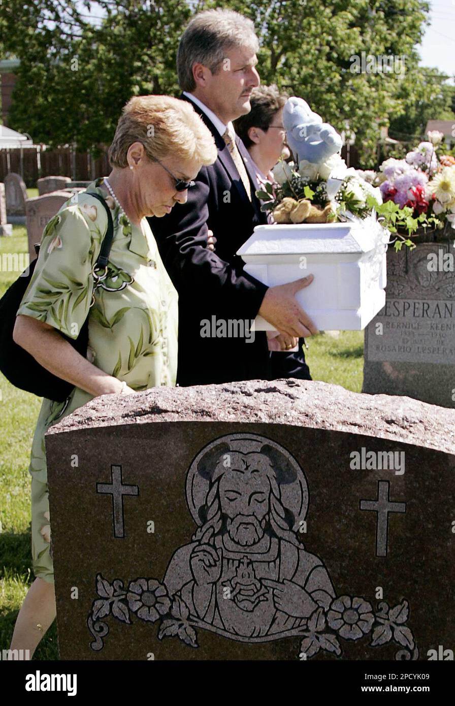Funeral director Rejean Decarie carries the casket of "Baby Hubert ...