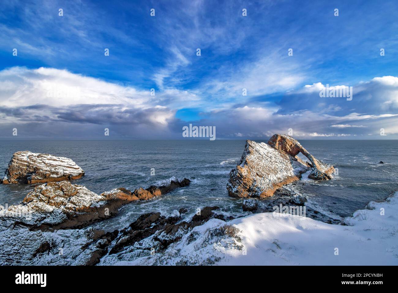 Bow Fiddle Rock Portknockie Scotland early morning snow blue sky and ...