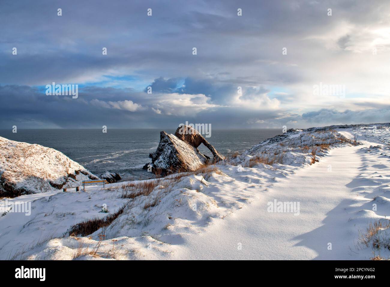 Bow Fiddle Rock Portknockie Scotland early morning snow over rock and ...