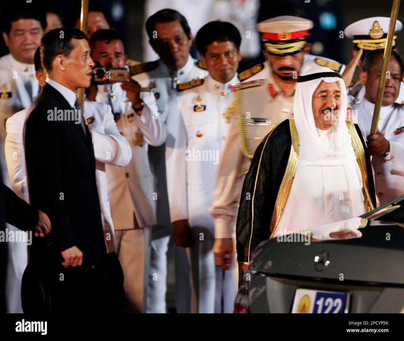 Kuwait's Emir Sheikh Sabah Al-Ahmad Al-Jaber Al-Sabah, right, walks ...