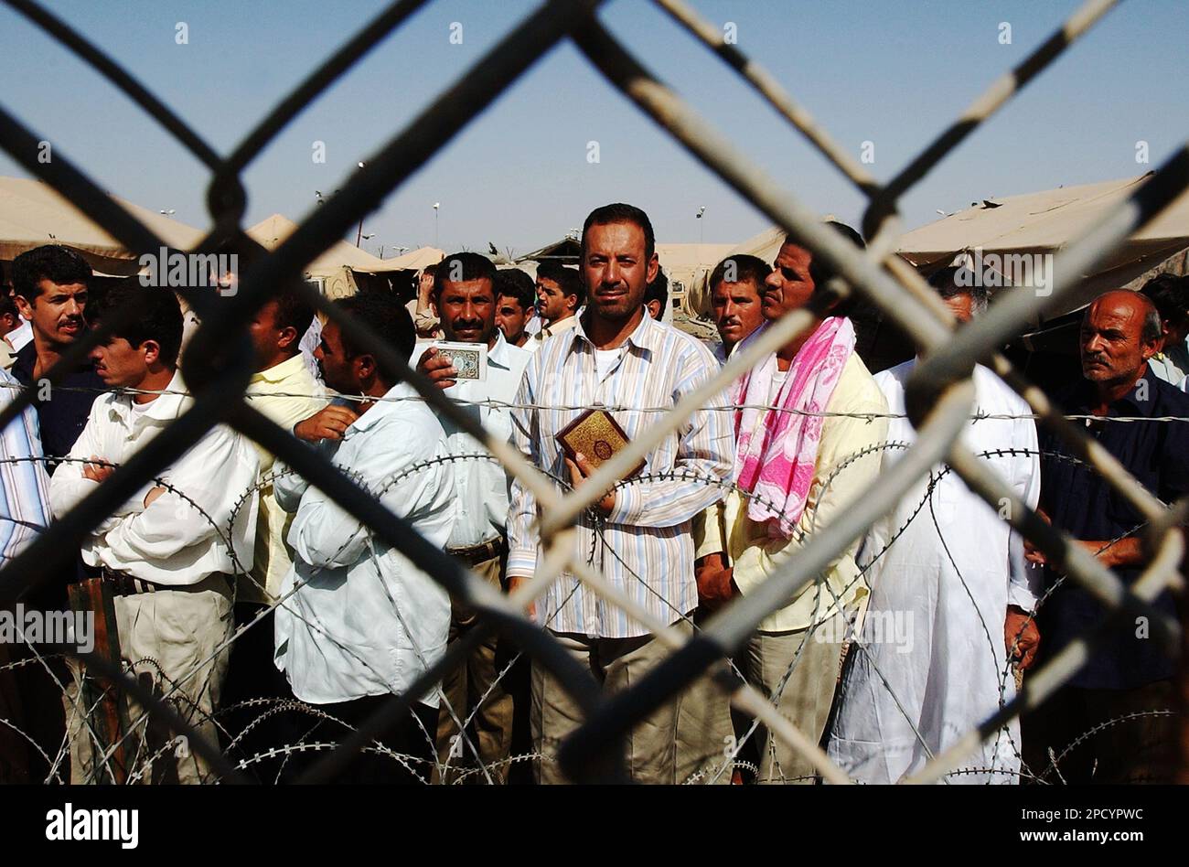 Iraqi detainees wait to be released at Abu Ghraib prison, west of ...