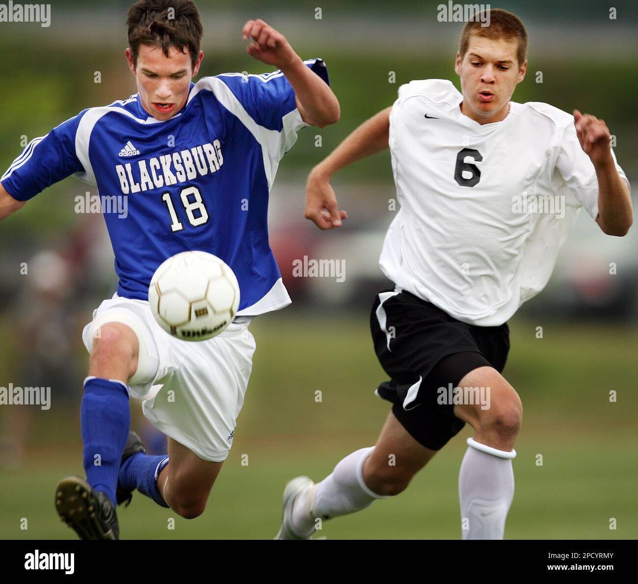 Blacksburg's Evan Carstensen, left, controls a loose ball against ...