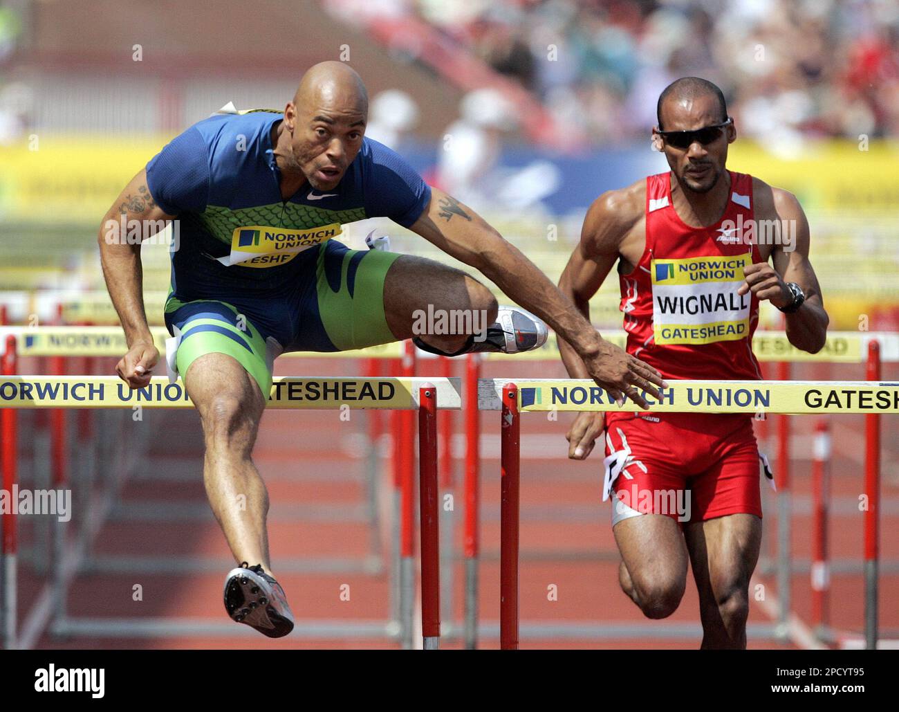 Dominique Arnold, left, is ahead of Maurice Wignall right during the ...