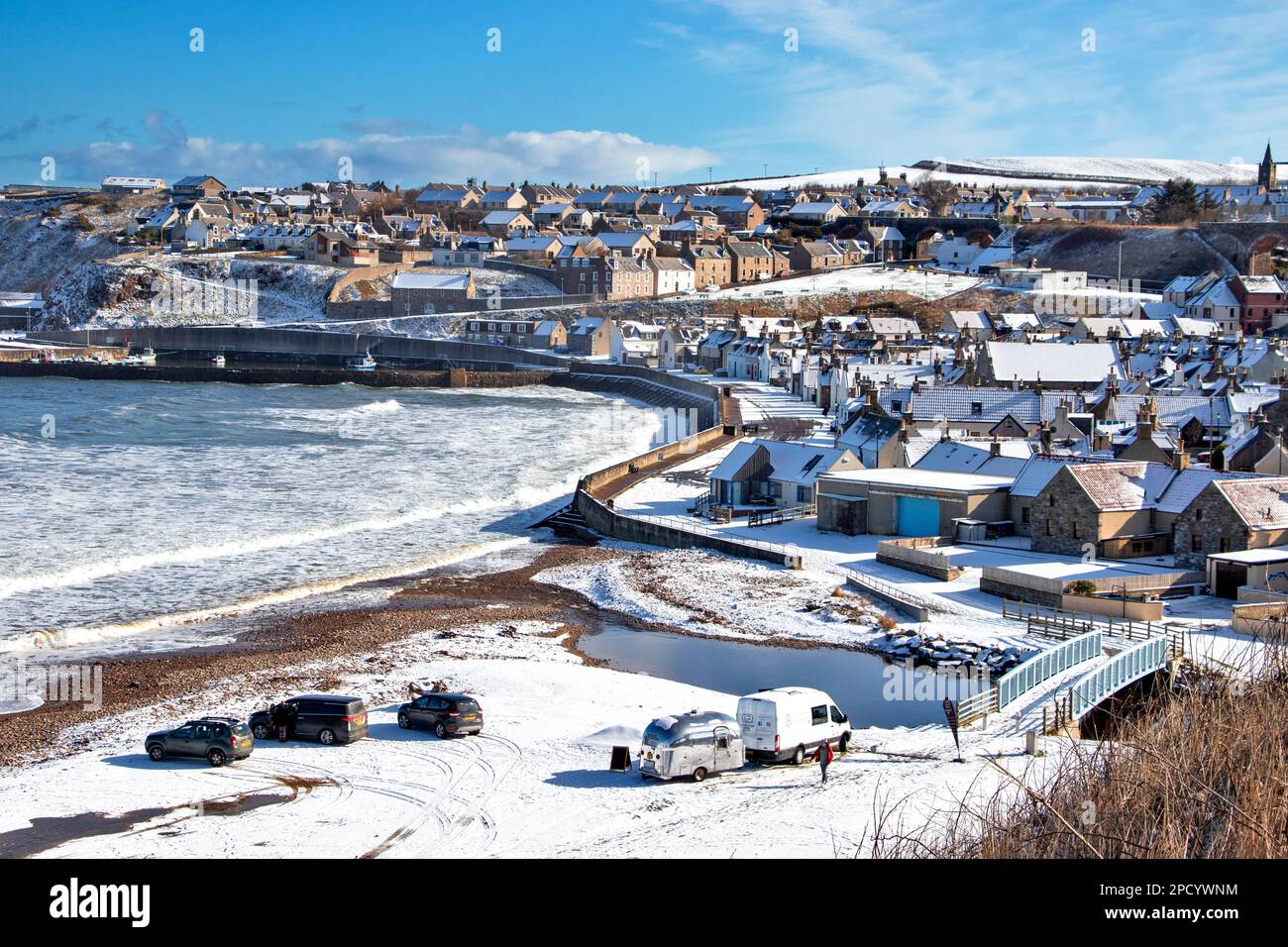 Cullen Bay Moray Scotland blue sky over snow covered houses and the ...