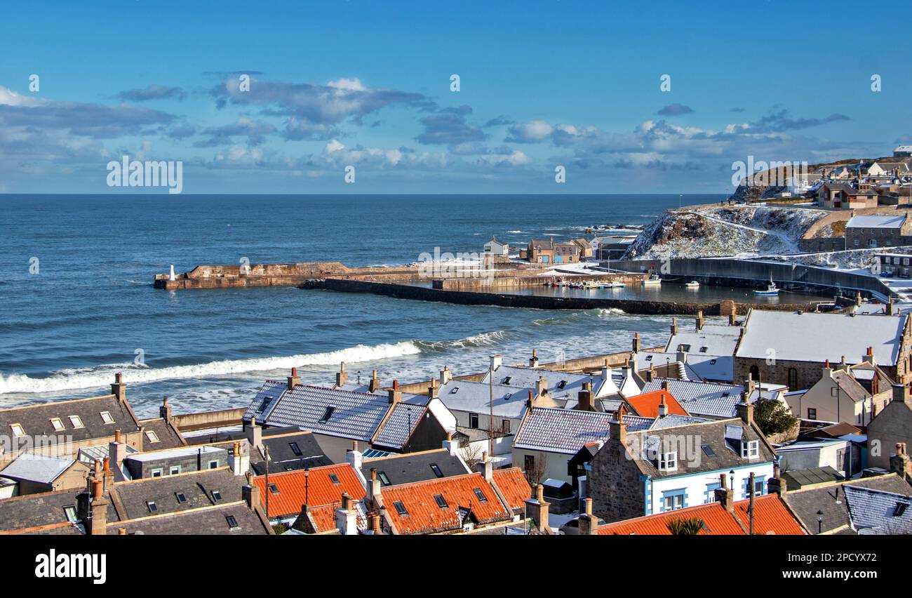 Cullen Bay Moray Scotland winter scene a blue sky waves and snow ...