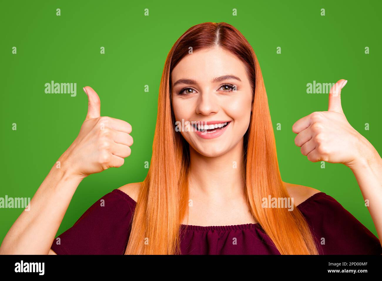 Red straight-haired attractive cute nice young girl showing double ...