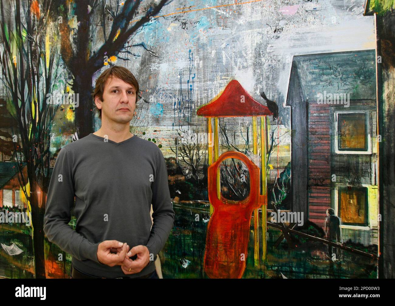 German artist Daniel Richter poses in front of his painting "Poor Girl ...