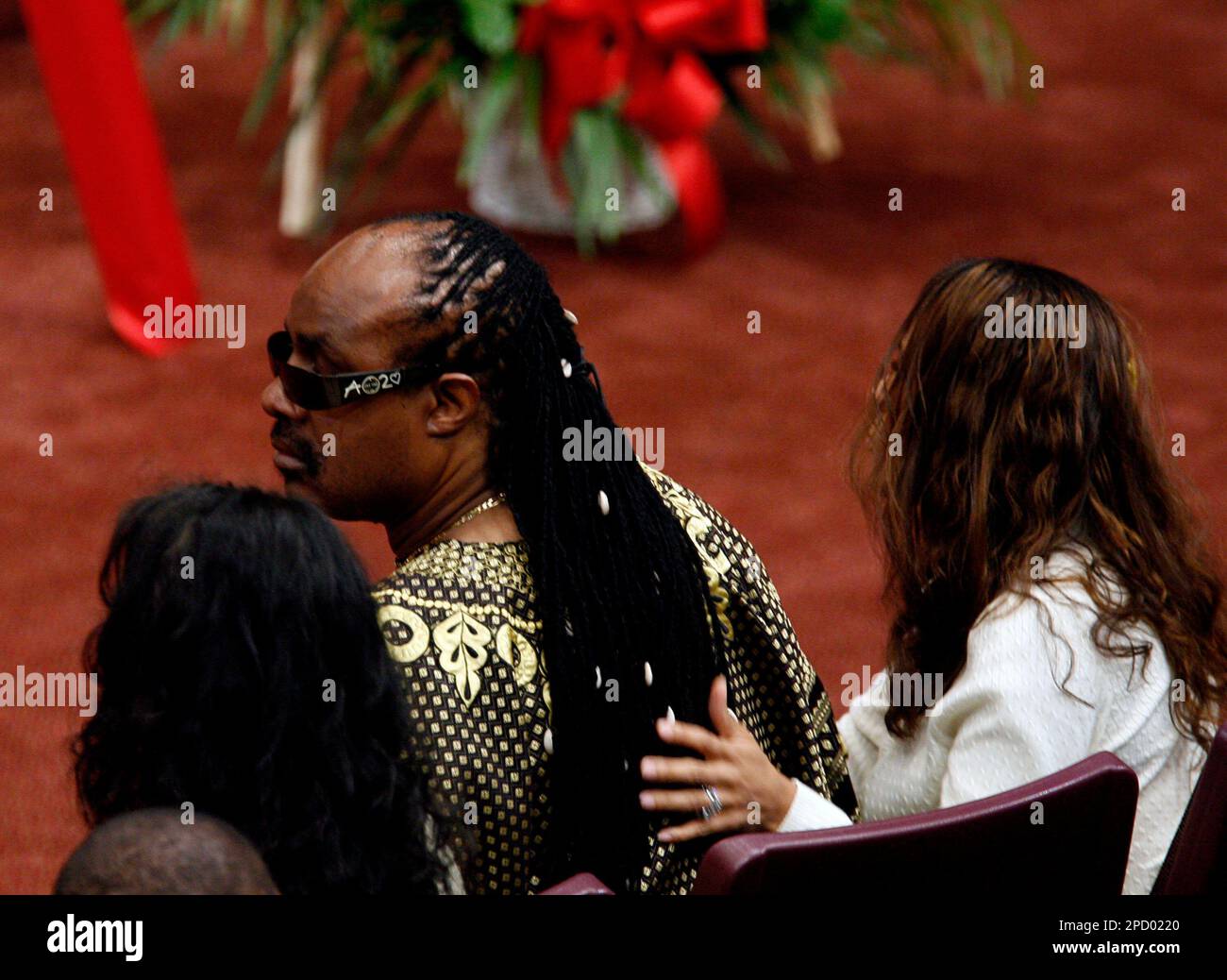 Singer Stevie Wonder, center, is comforted as he attends the funeral of ...