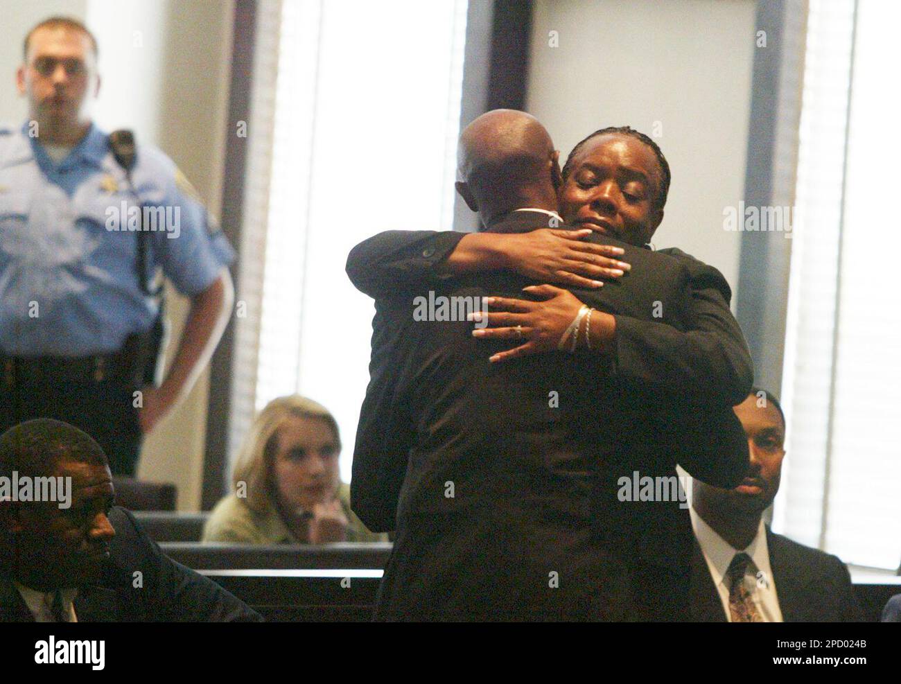 Judith Samuel, mother of Meshia Samuel, hugs prosecutor Kernard Redmond ...