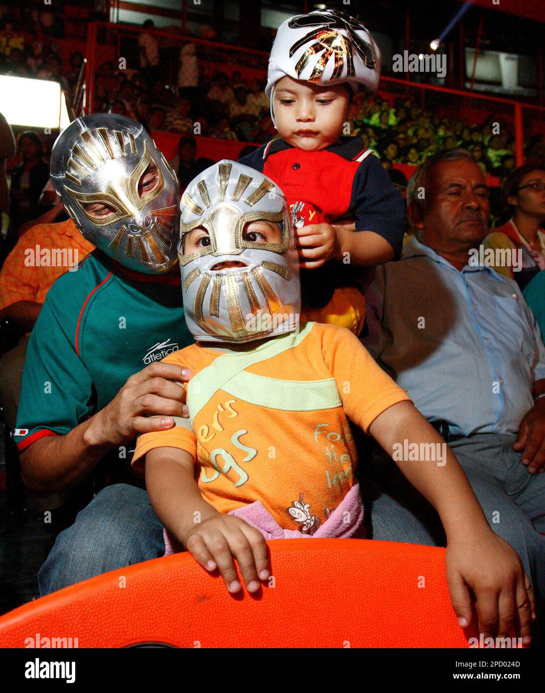 Miguel Hernandez, left, looks on with sons Javier, front, and Tomas ...