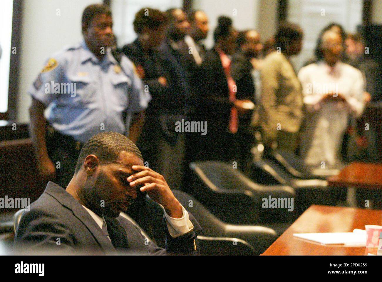 James Jamal Williams sits alone in the courtroom as family and friends ...
