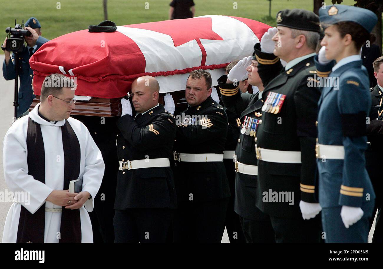 The casket of Capt. Nichola Goddard arrives at the military cemetery ...
