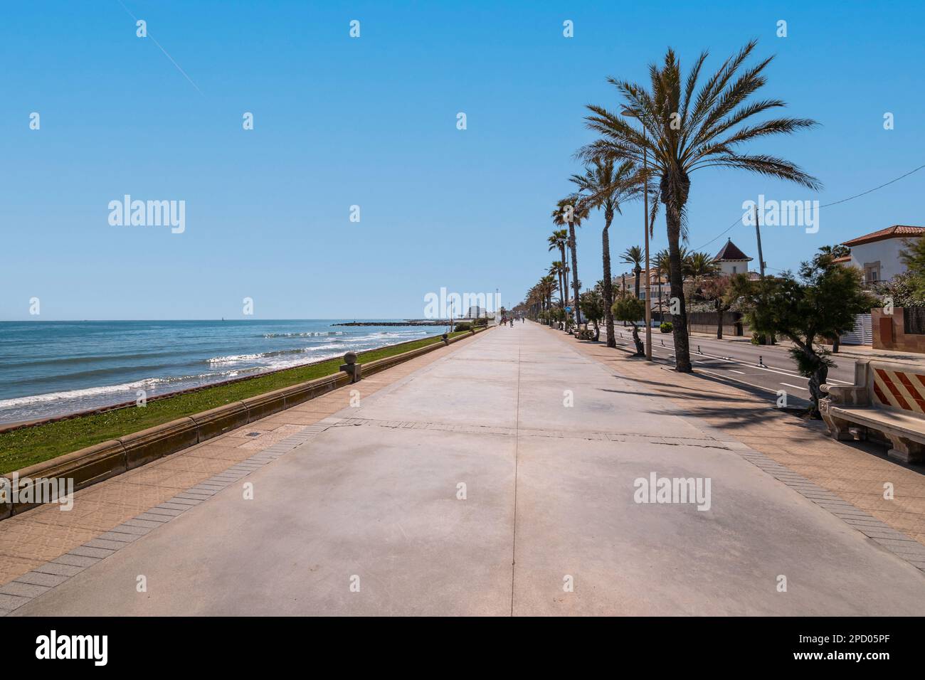 Stunning view of the promenade on backdrop of the sea, blue sky and ...